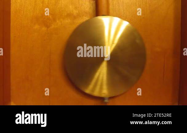 The soothing swing of a pendulum in a clock Stock Video Footage - Alamy