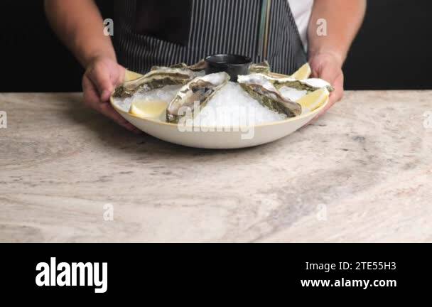 oyster delicacy beautifully presented on a platter with oyster sauce ...