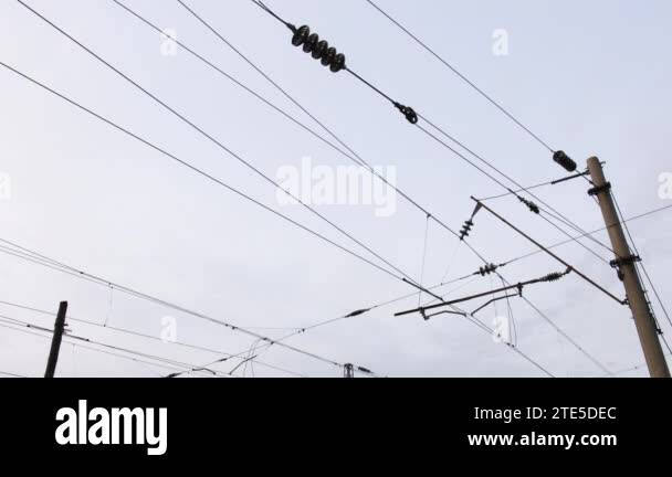 Electric wires on the railway. Transmission lines. View below. railway ...