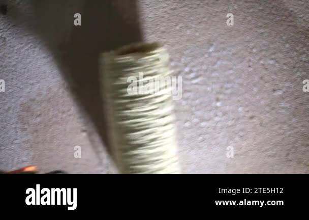 Applying a liquid primer coating a construction roller is preparation ...