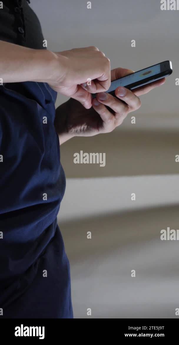Man using smartphone, pressing with finger, reading online social ...