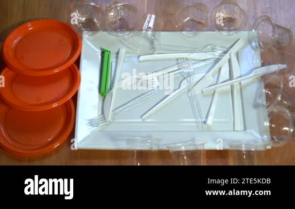 various disposable plastic objects - disposable plastic plates, forks ...
