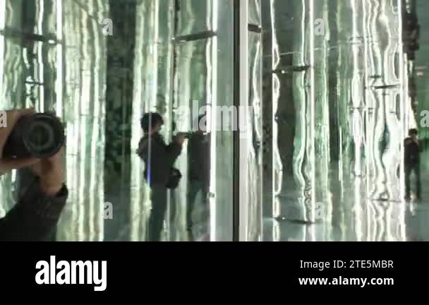 Visitor Filming Inside Large Art Installation Of Large Moving Mirrors ...