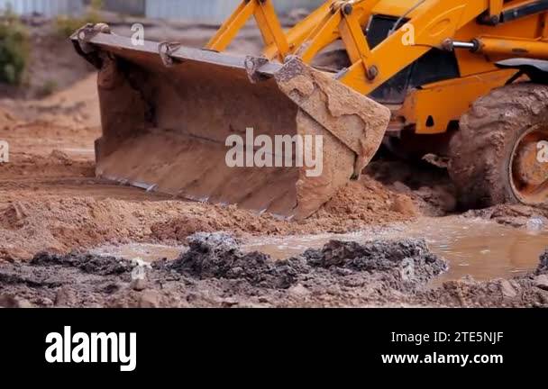 Tractor bucket at a construction site. The bucket of a modern tractor ...