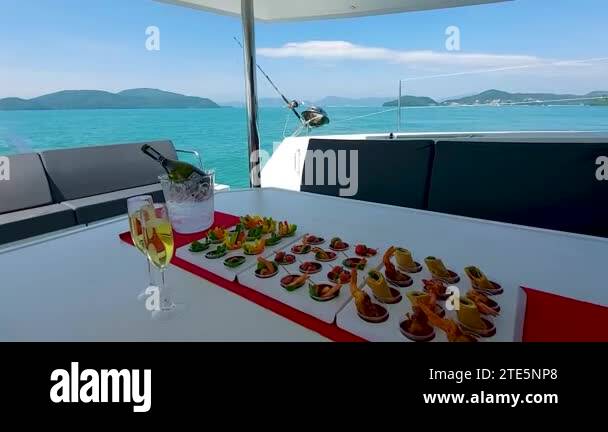Champagne and snacks on board the sailing catamaran, food and drink for ...