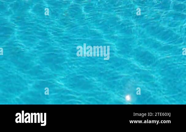 Water drop in swimming pool. Blue color. Stop motion video. H2O hotel ...