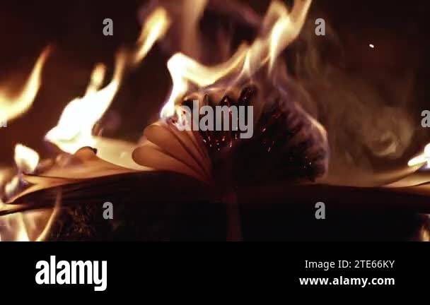 Old open book is burning. Big bright flame on papers. Destruction of ...