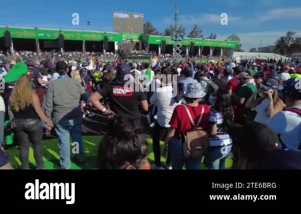 Mexican fans spectators attending listening enjoying the DJ concert ...
