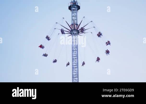 Rotating a Chain Carousel with a Lifting Mechanism in an Amusement Park ...
