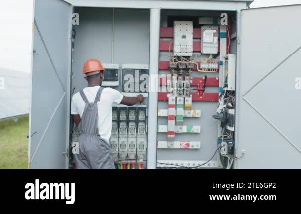 Concept of people, maintenance and alternative energy. Electrical ...