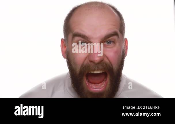 Portrait of angry man screaming in studio. Rage guy shouting on white ...