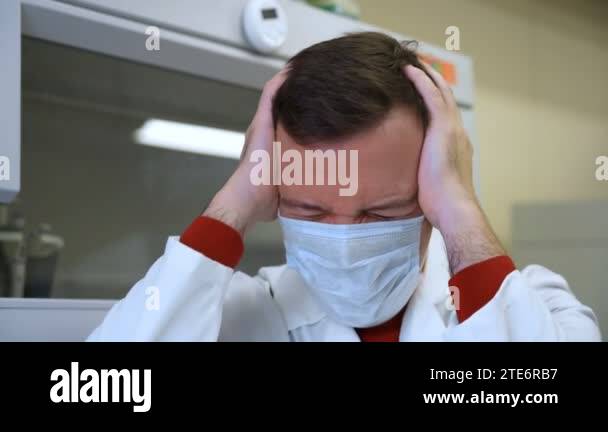 Man headache stress lab Stock Videos & Footage - HD and 4K Video Clips ...