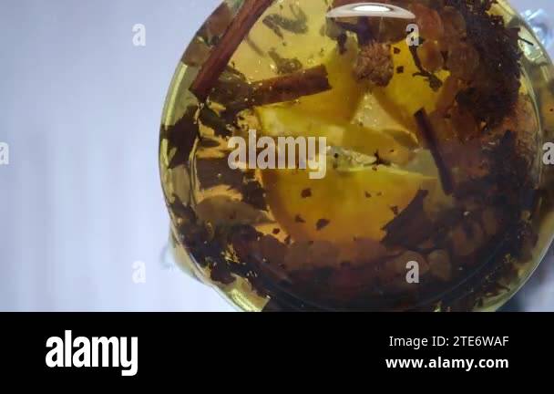 The process of making aromatic tea. Glass transparent teapot, bottom ...