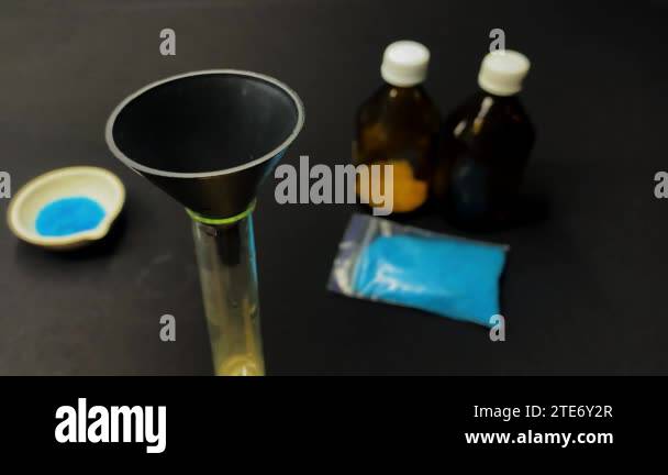 Lab footage, experiments with blue reagents, heating test tubes and ...