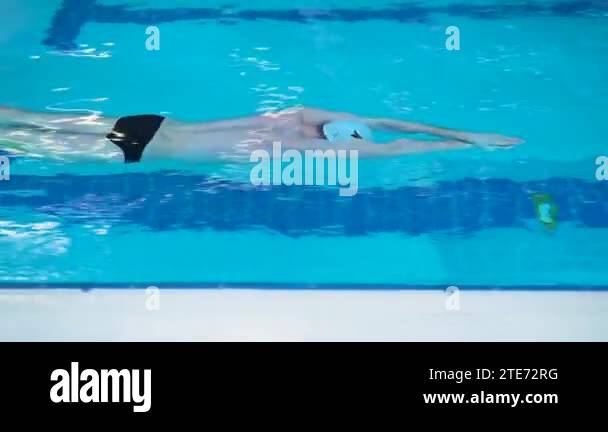 Professional swimmer in a sports pool healthy lifestyle concept ...