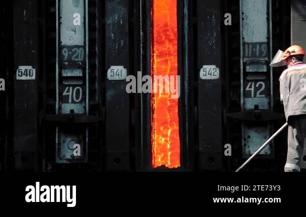 Coke oven battery. Red-hot coke in a coke oven battery. Coal coking ...