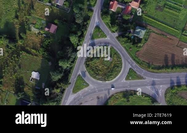 Roundabout traffic of cars and trucks on the circle ring road aerial ...