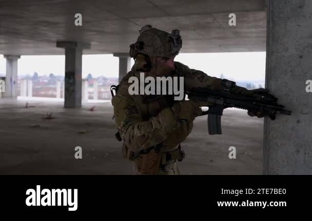 Special forces operator wearing Multicam uniform and his assault rifle ...