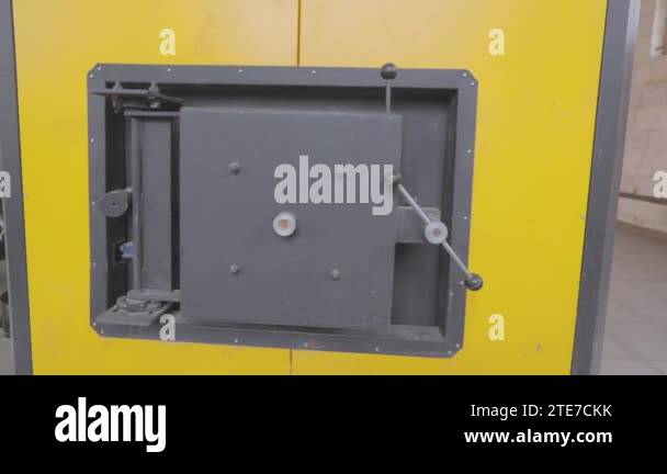 Wood waste oven. Modern recycling furnace. Boiler room. Inside a modern ...