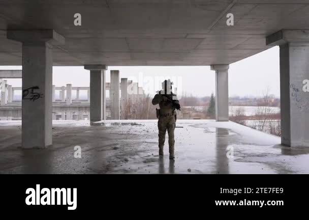 Special forces operator wearing Multicam uniform and his assault rifle ...