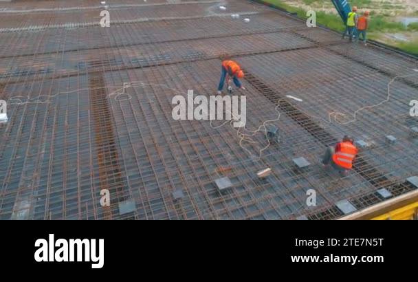 Creation of metal structures. Builders create metal structures, a frame ...