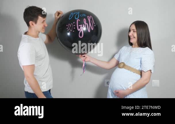 young parents find out the gender of their unborn child by popping a ...