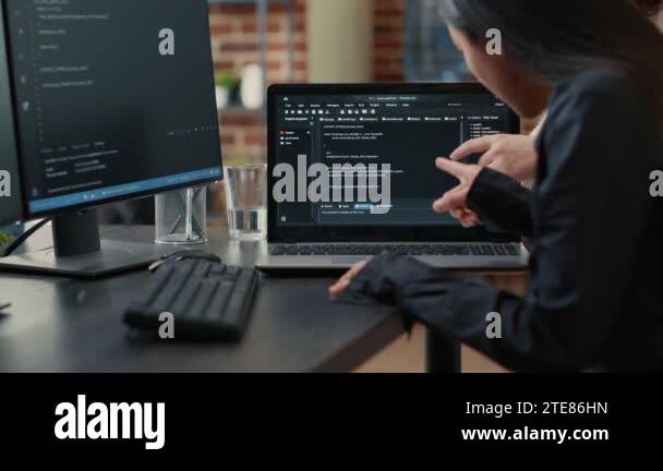 Team Of Programmers Talking About Algorithm Running On Laptop Screen Pointing At Source Code