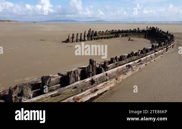 Shipwreck on the Cefn Sands beach at Pembrey Country Park in ...