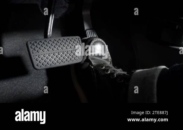 Accelerate and Brake. Foot pressing foot pedal of a car to drive ahead ...