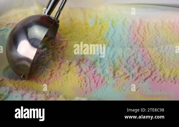 Scoop rainbow ice cream with spoon. Pattern and color of ice cream ...