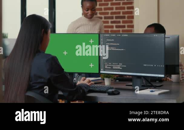 Software Developer Writing Algorithm In Front Of Computer With Green Screen Chroma Key Mockup