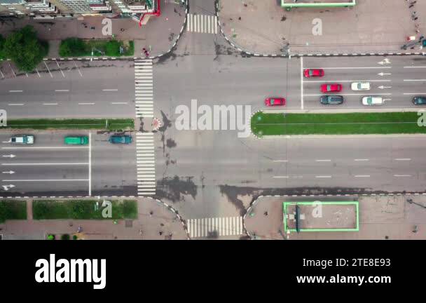 Cars pass City intersection of city multi-lane road. Road traffic at ...