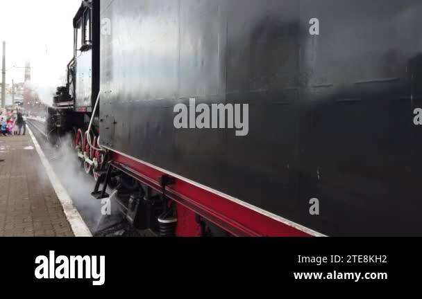 A retro steam locomotive prepares to leave the station Stock Video ...
