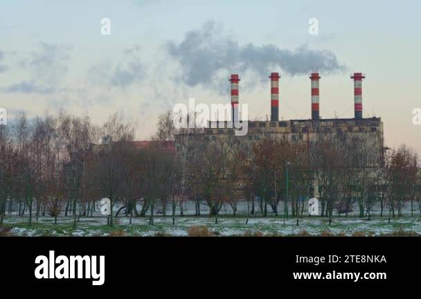 Factory in the middle of a city causing air pollution near water ...
