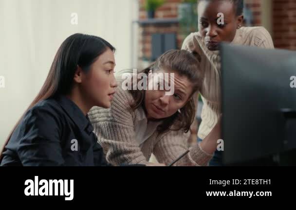 Software Engineer Pointing At Computer Screen Explaining Running Code 4216