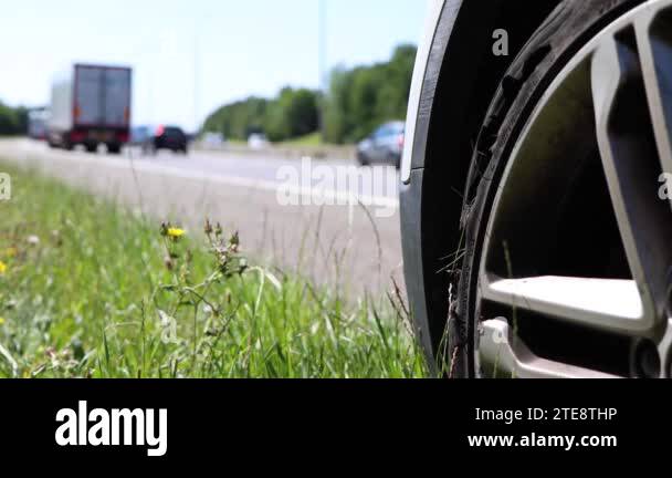 Uk car puncture road Stock Videos & Footage - HD and 4K Video Clips - Alamy