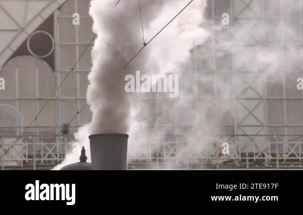 Steam pipe of steam locomotive of railway. Factory pipe of steam ...