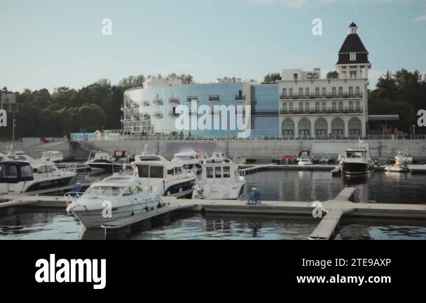 A large beautiful modern yacht club with glass parallel windows and a ...