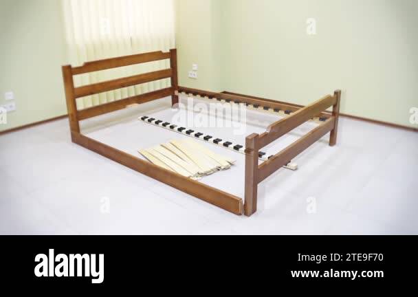 mounting of the frame of an orthopedic double wooden bed with a rigid ...