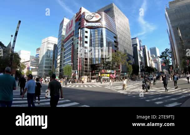 Tokyo, Japan - October 23, 2019: Slow motion video of walking along Ginza crosswalk Sukiyabashi ...
