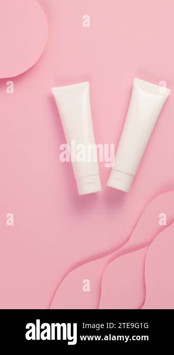 Vertical stop motion animation. White cream tube appear on pink paper ...