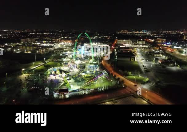 Night scape landscape of illuminated attraction at amusement park at ...