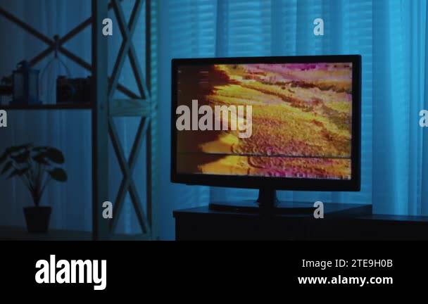 TV set with background damage and image glitch. Distorted horizontal ...