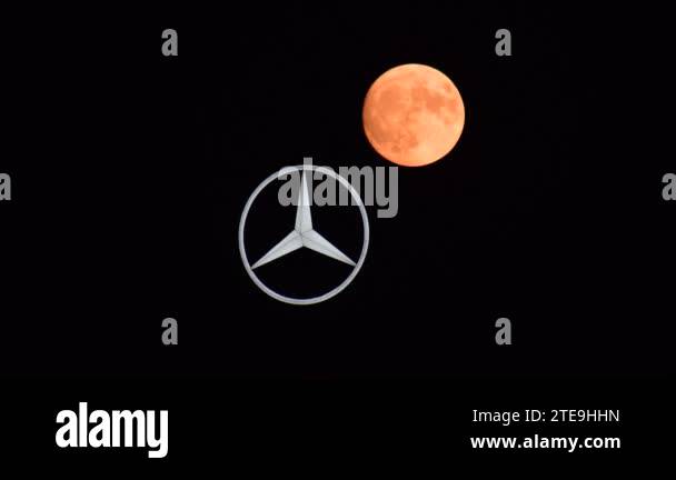 Mercedes Benz Sign or logo rotates on the roof and a full moon appears ...