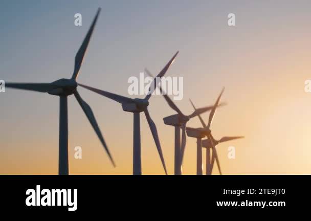 wind turbine with blades turn on nature background with sunset sky ...