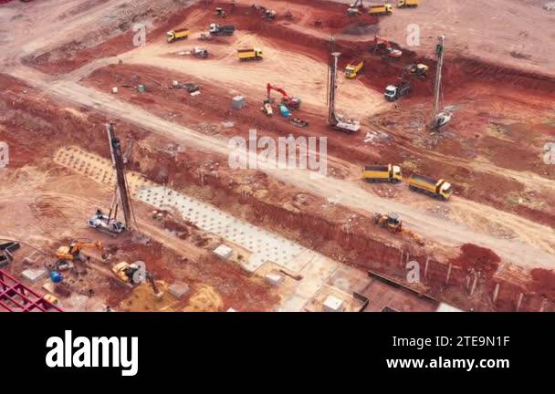Construction Equipment works on Construction Site: Excavators, Trucks ...