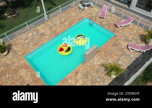 Top view of smile emoji float at swimming pool. Float smile emoji ...
