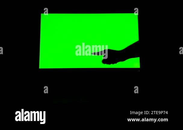 Chroma key on electronic devices, phone and monitor, green screen and hand scrolling through the ...