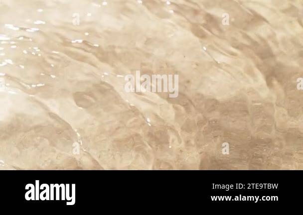 Super slow motion of water waves with sand texture. Filmed on high ...