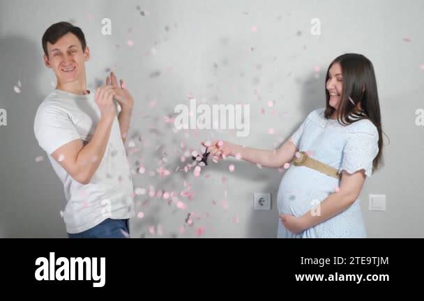 young parents find out the gender of their unborn child by popping a ...